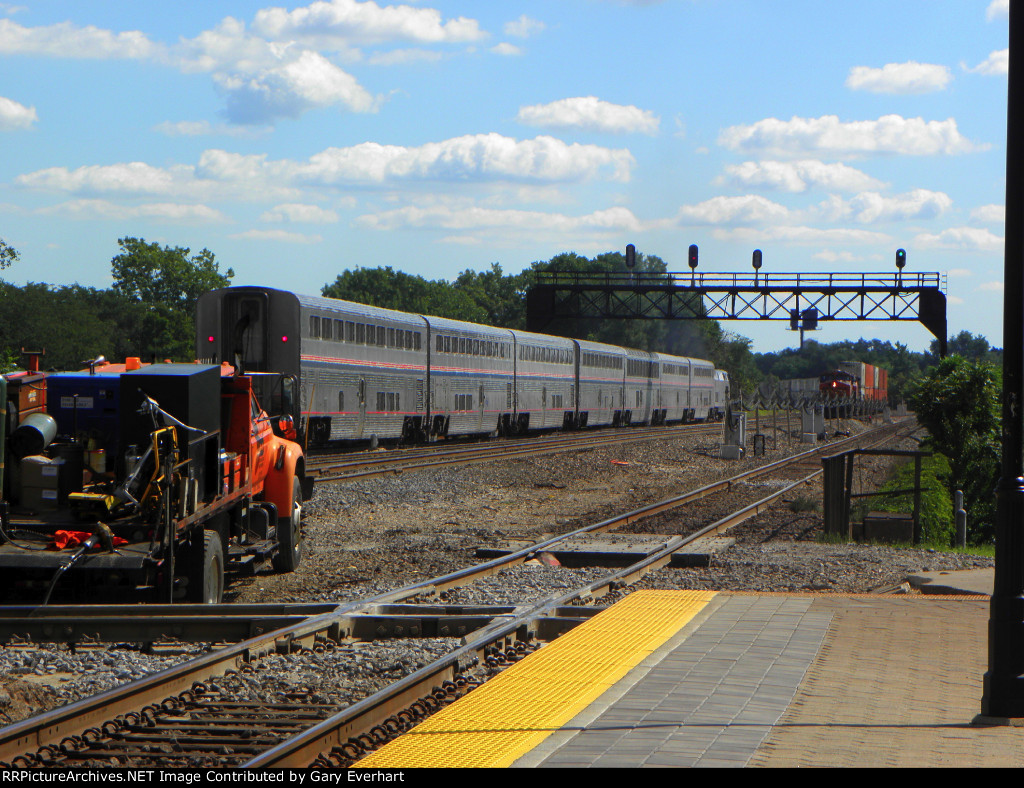 Southbound Texas Eagle meets northbound BNSF double stack freight